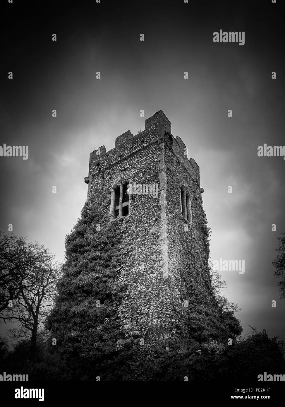 A spooky old church tower stands alone Stock Photo - Alamy