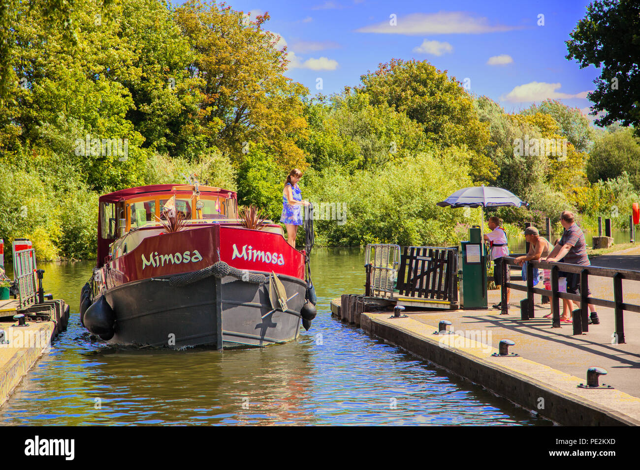 Woman on a Dutch barge passing through Abingdon locks on the river ...