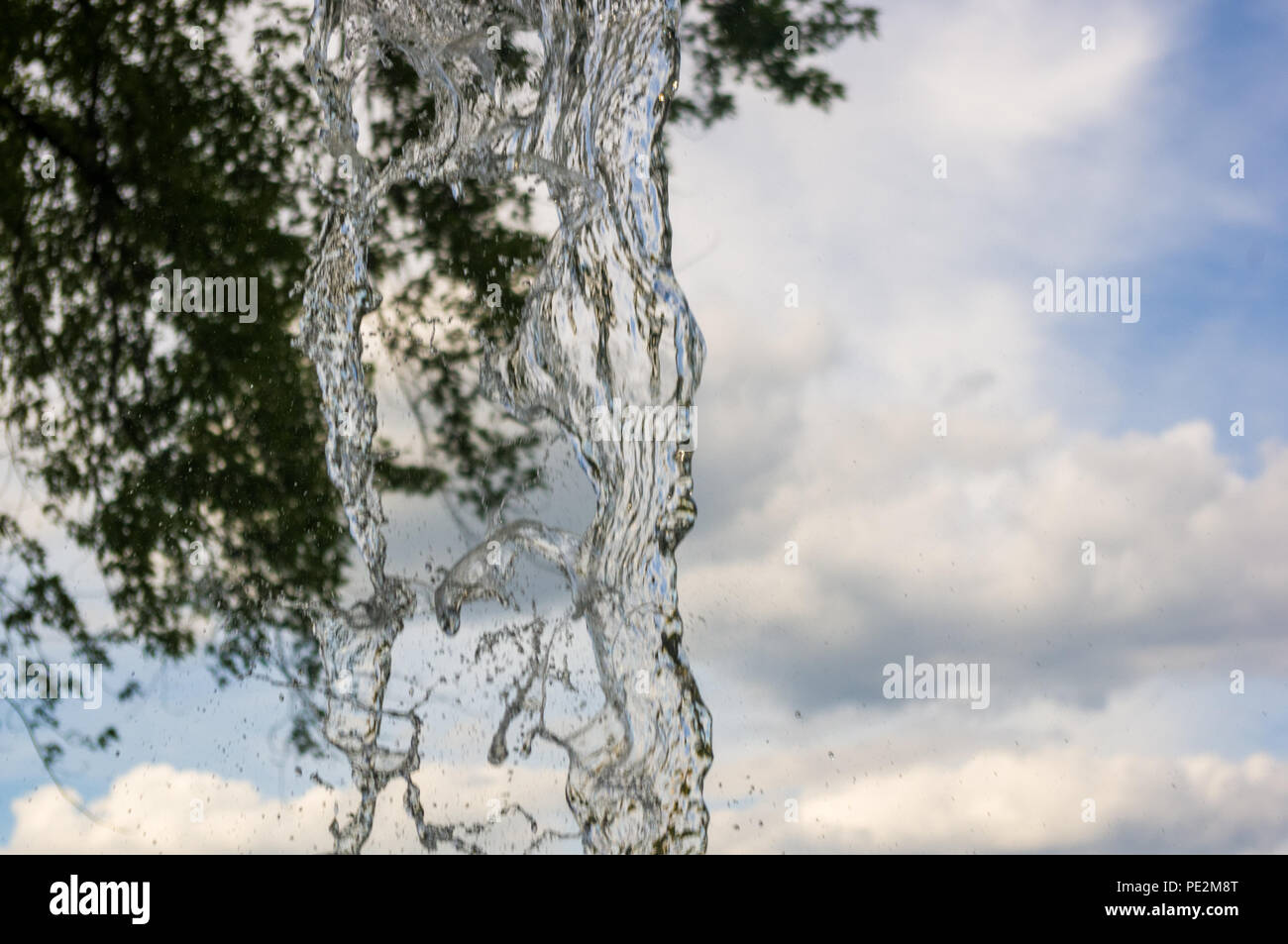 transparent falling water vertical flows, close up Stock Photo - Alamy