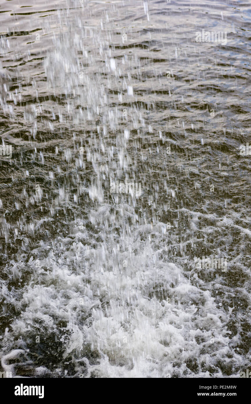 transparent falling water vertical flows, close up Stock Photo - Alamy