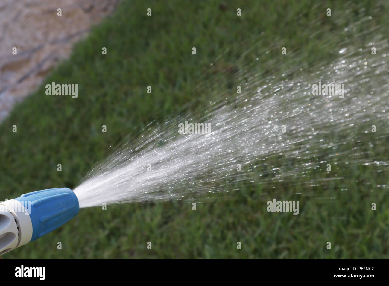 Using a hose pipe hi-res stock photography and images - Alamy