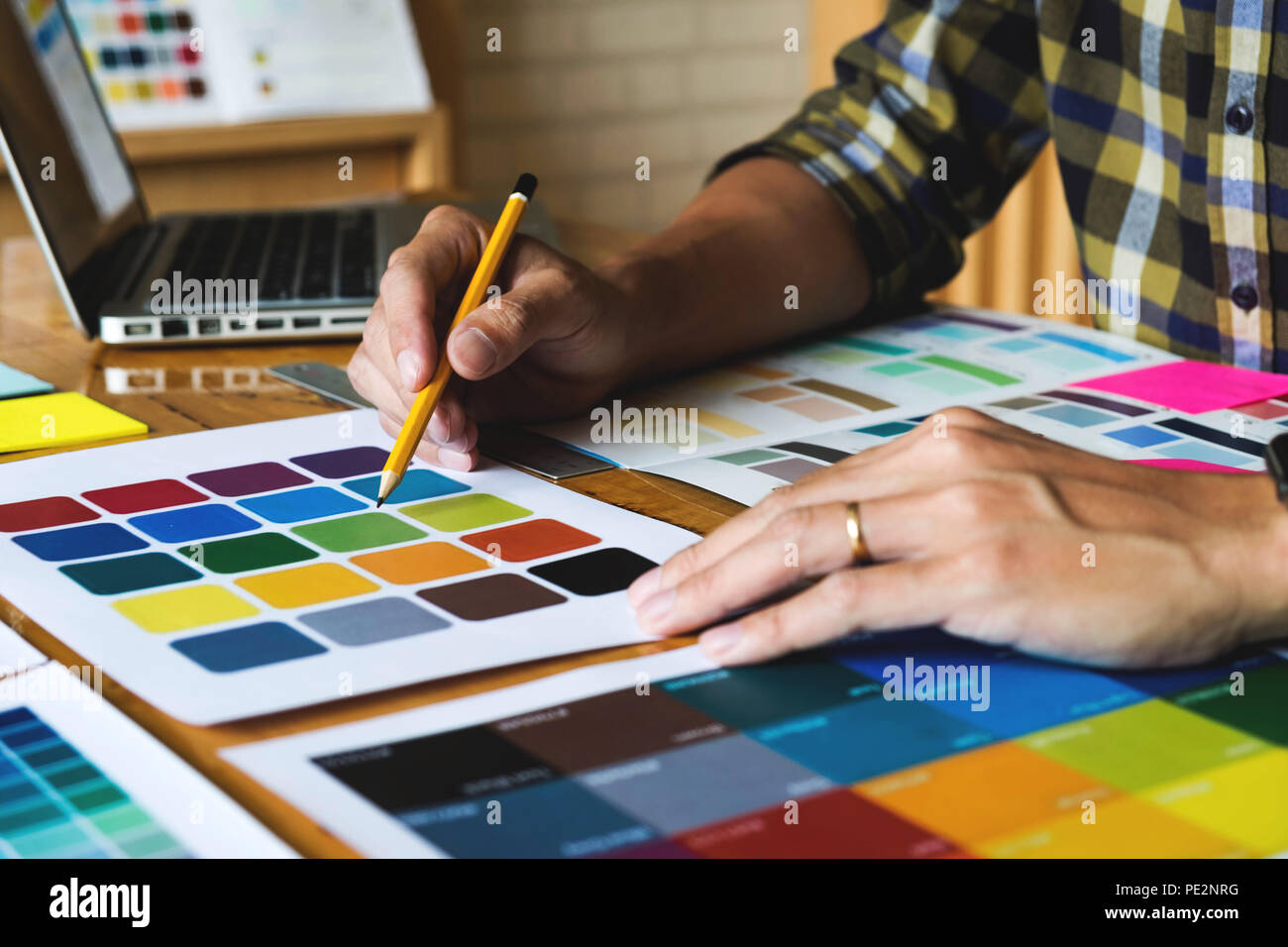 Graphic designers choose colors from the color bands samples for design ...