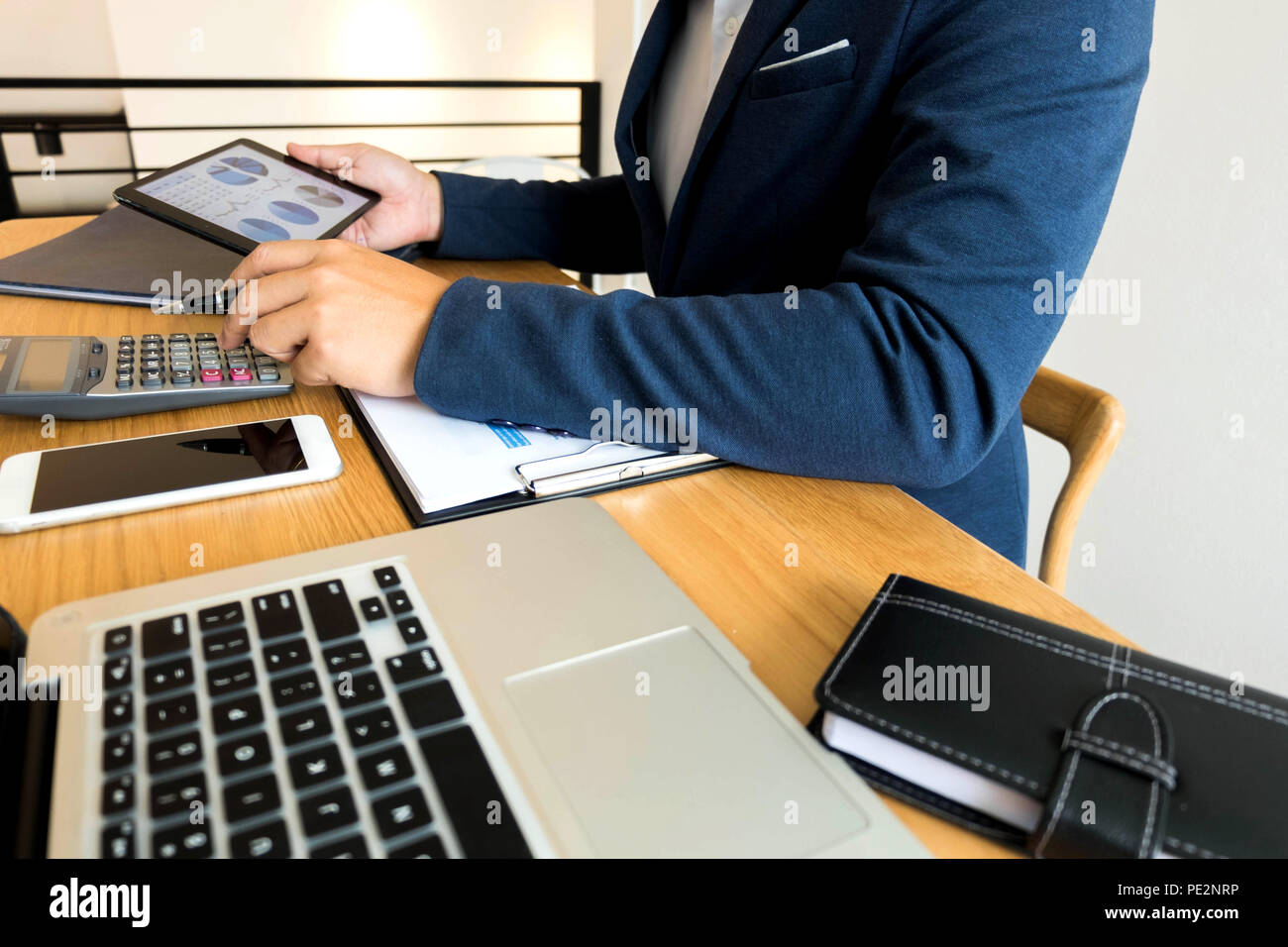 Business people using tablet to study data for business expansion ...