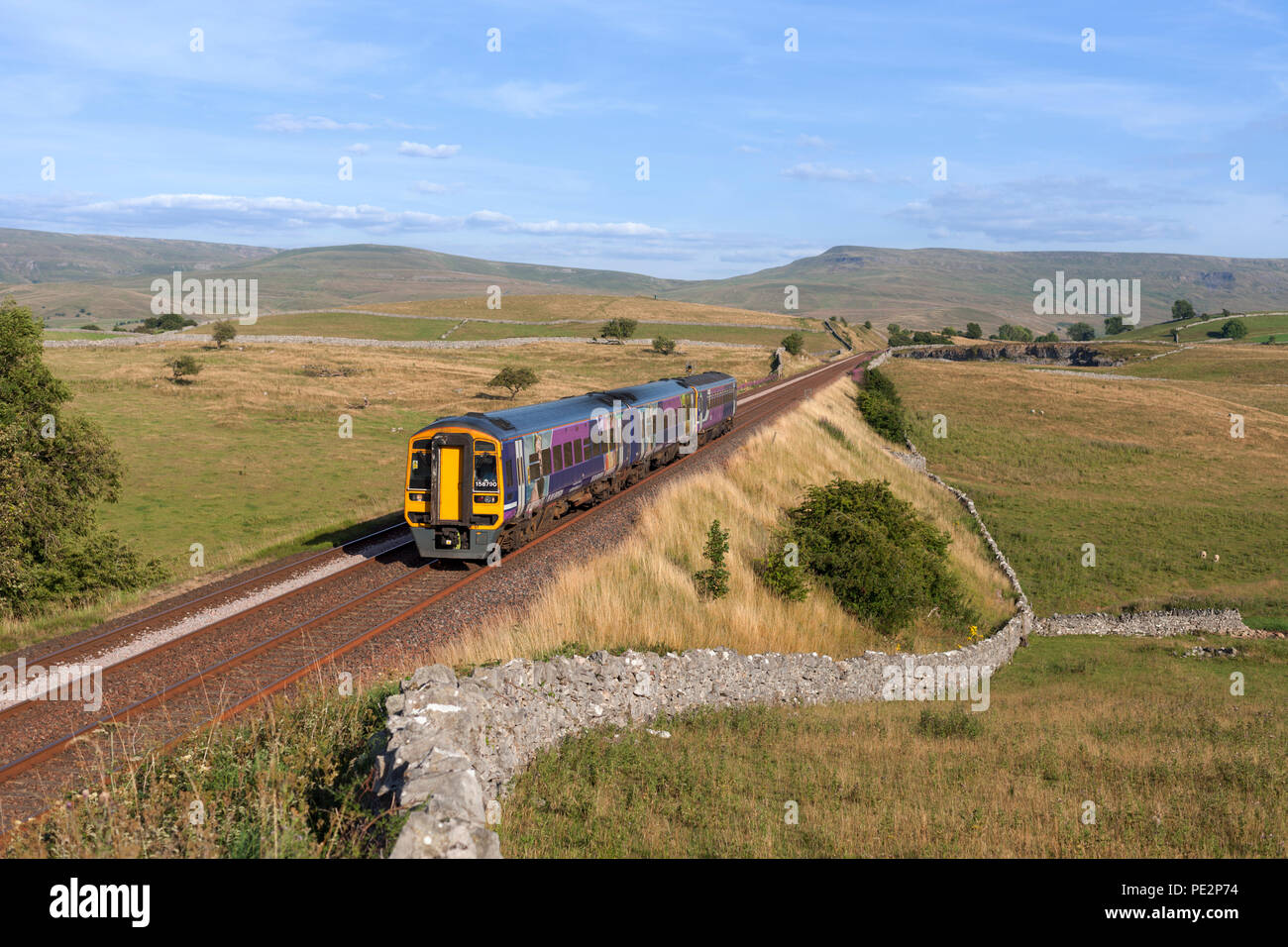 A Northern Rail class 158 express sprinter train passing Waitby (north ...