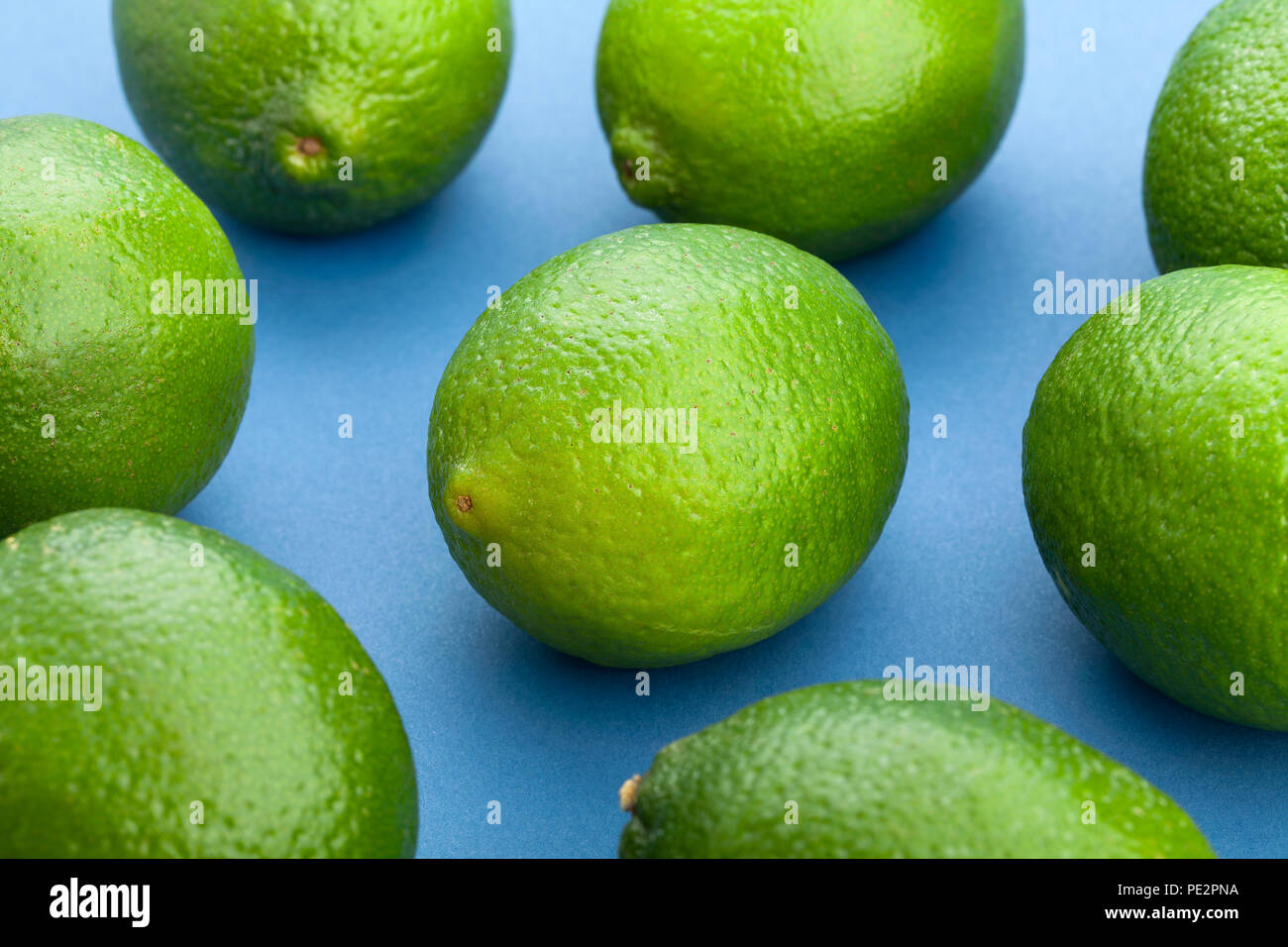 lime on blue background Stock Photo - Alamy