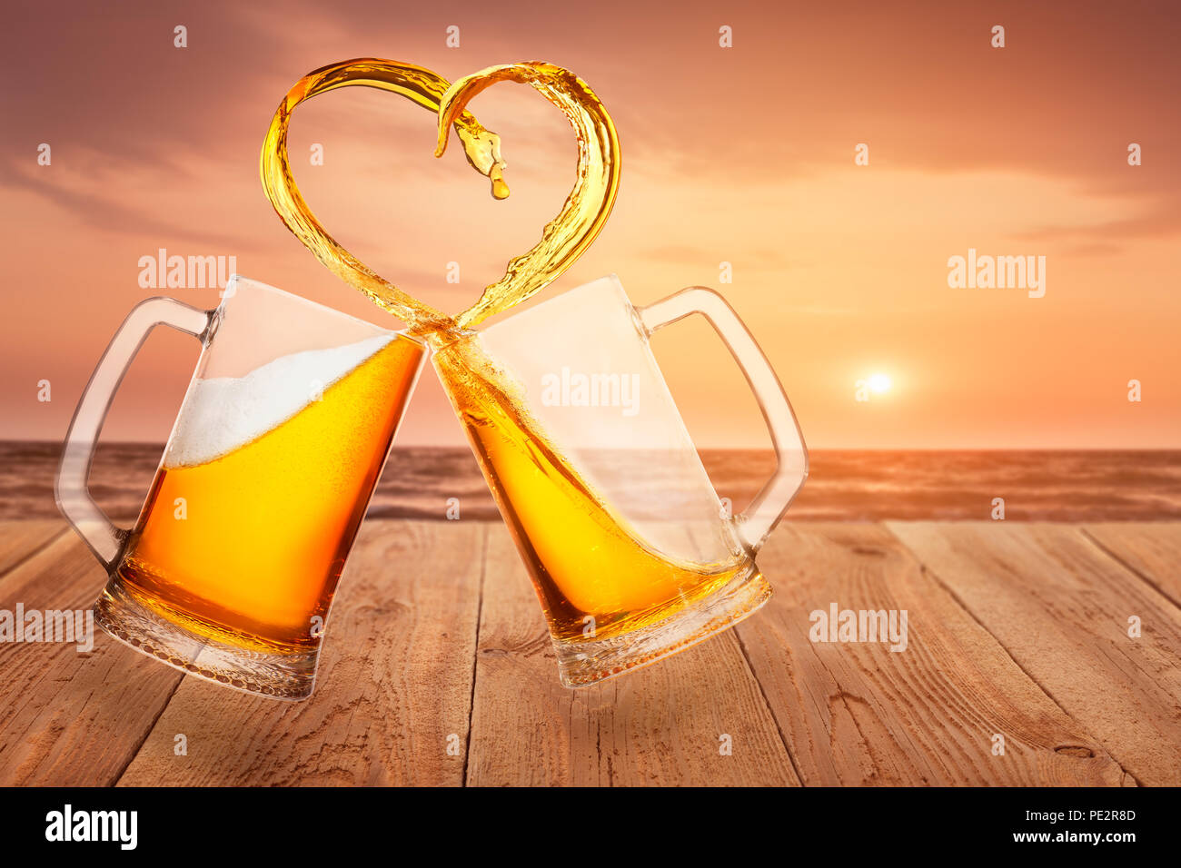love to beer concept. Two glass mugs toasting and creating splash of ...