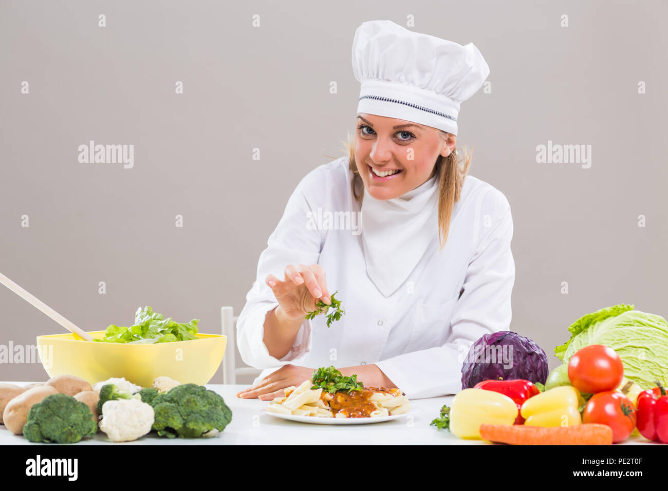 Food chef's hat table woman hi-res stock photography and images - Alamy