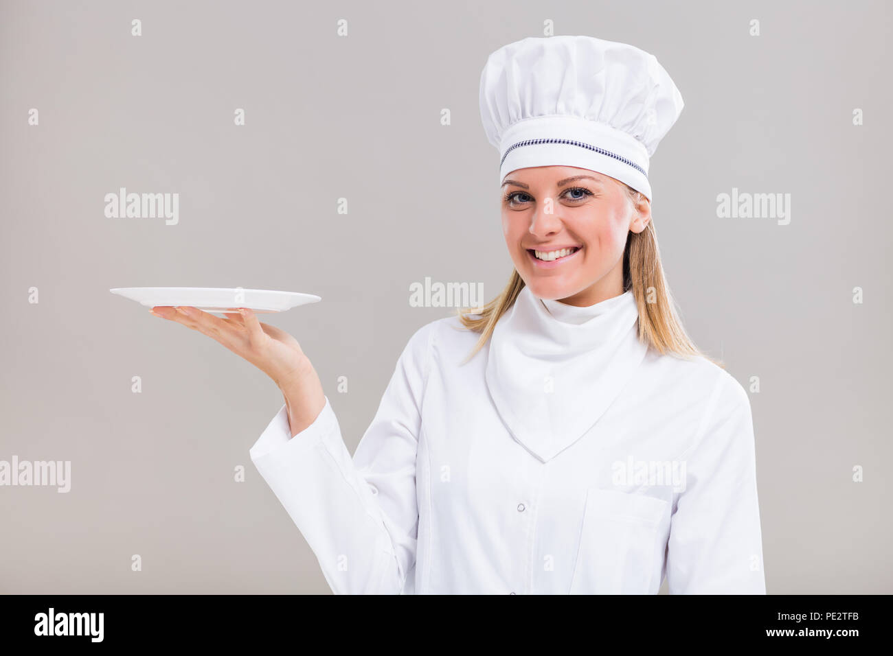 Beautiful female baker giving hi-res stock photography and images - Alamy