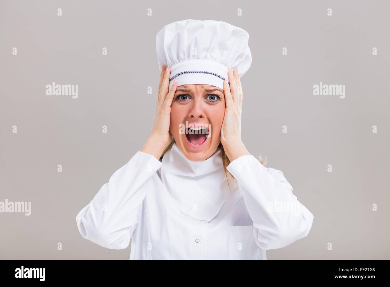 Female chef is in panic and she is screaming Stock Photo - Alamy