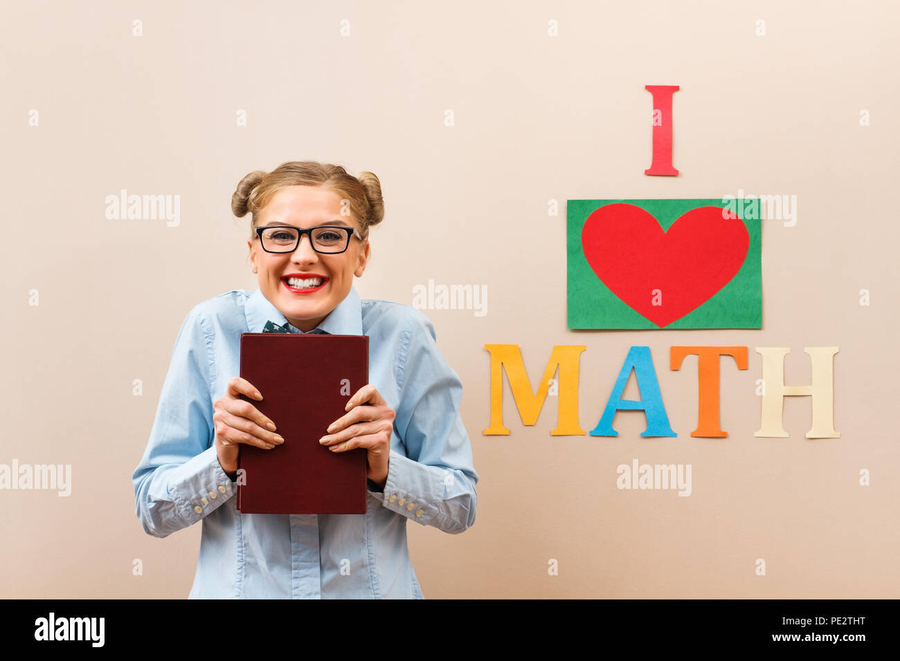 Happy nerdy woman loves math Stock Photo - Alamy