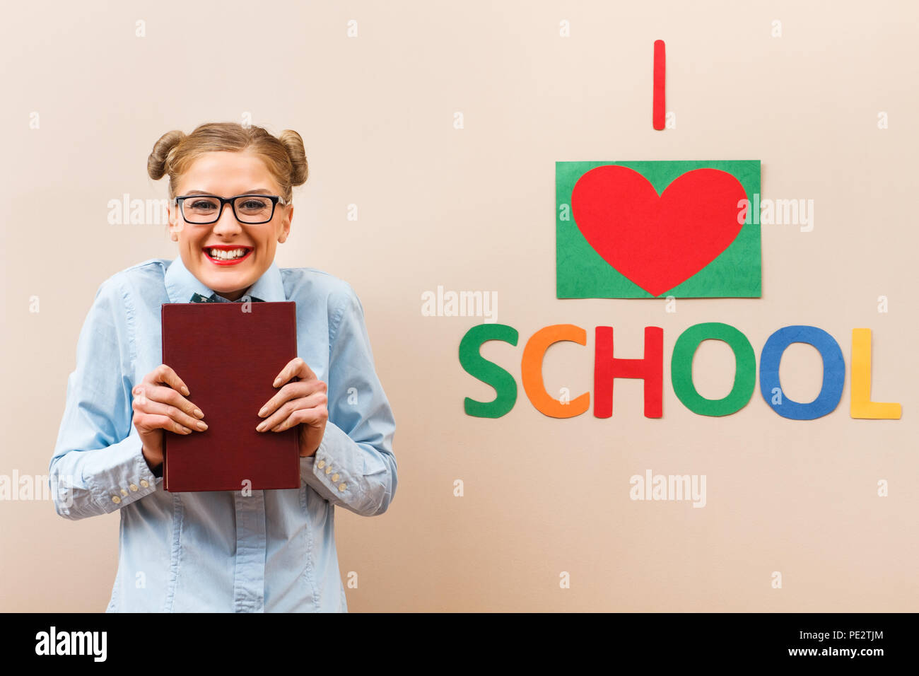 Happy nerdy girl can't wait to learn Stock Photo - Alamy