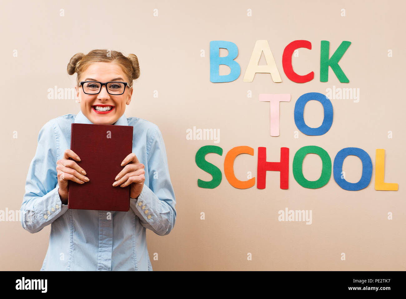 Happy nerdy girl can't wait to learn Stock Photo - Alamy
