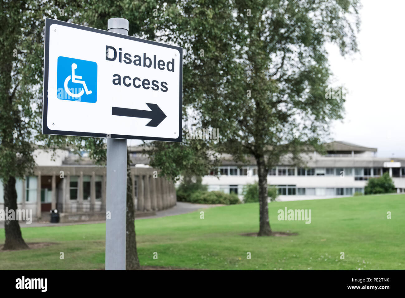 Disabled access sign for wheelchair users directional arrow at school ...