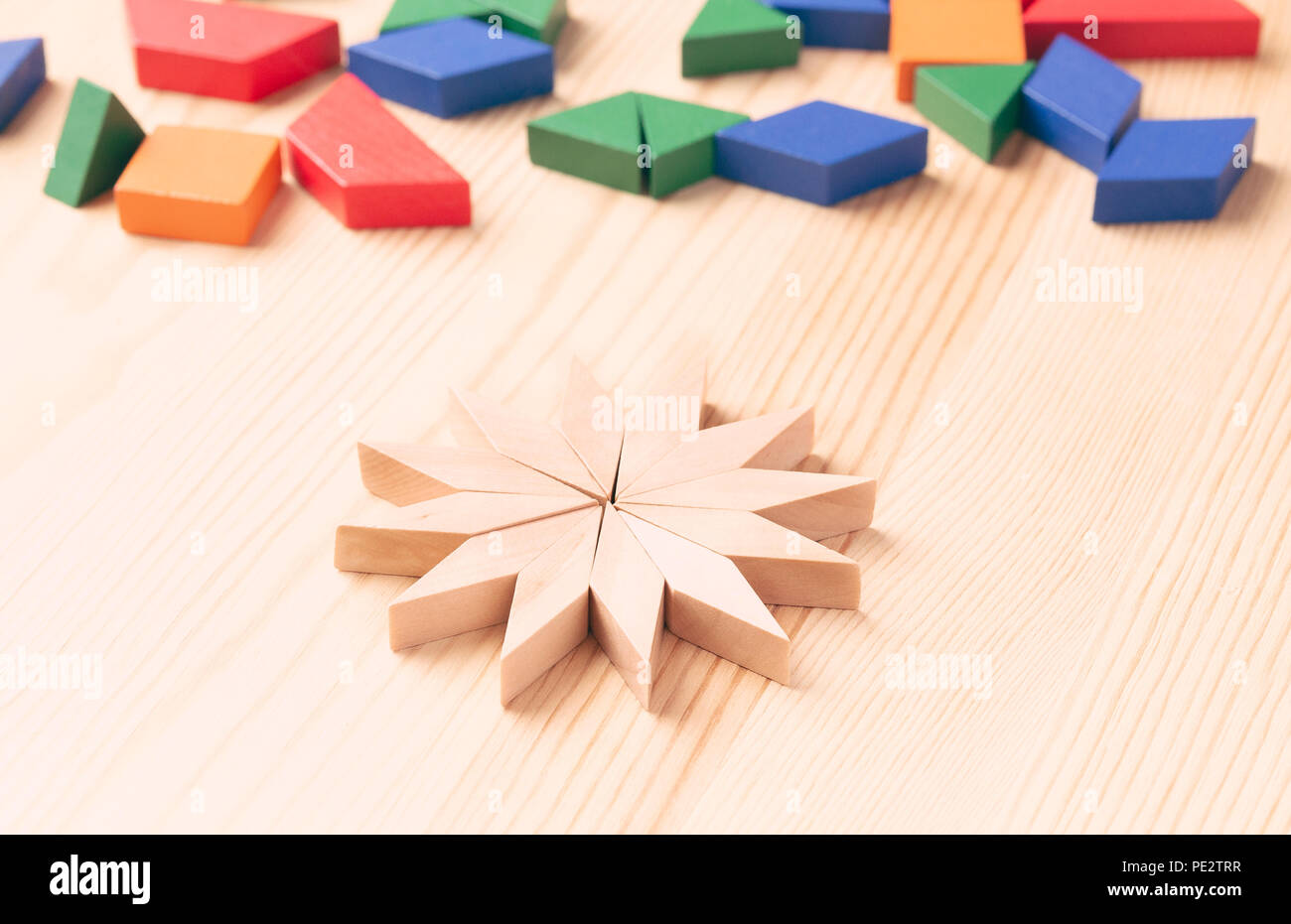 Children's game with colored wooden blocks. Draw a Pattern Stock Photo ...