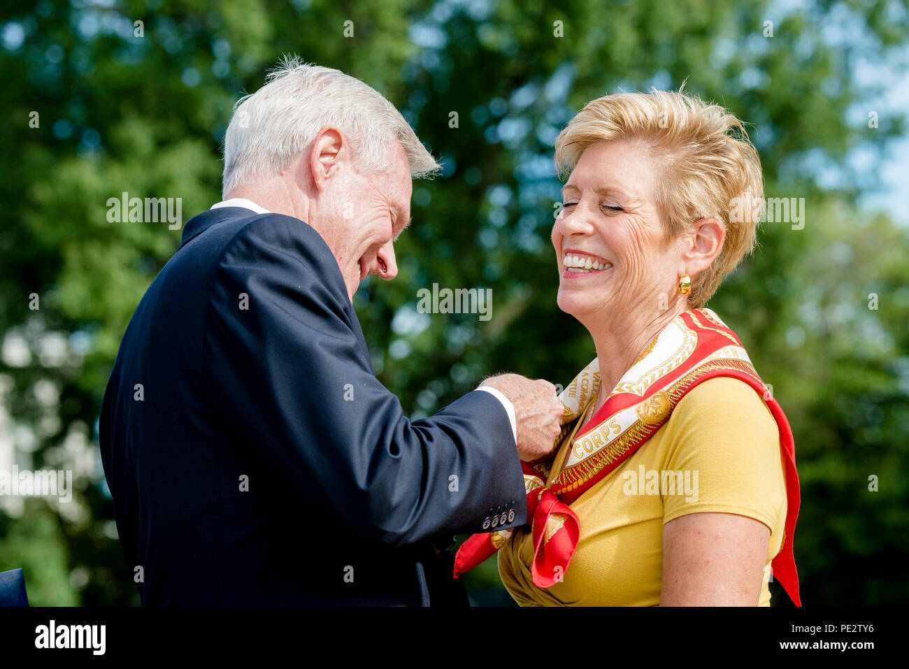 Secretary of the Navy Ray Mabus presents Ellyn Dunford an award during ...