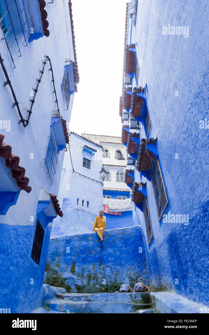 Blond girl is visiting in Chefchaouen (Chaouen) city in Morocco noted ...