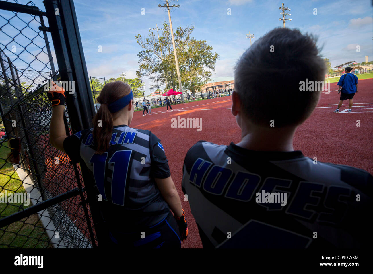 U.S. Air Force women’s softball team members look on as they compete ...