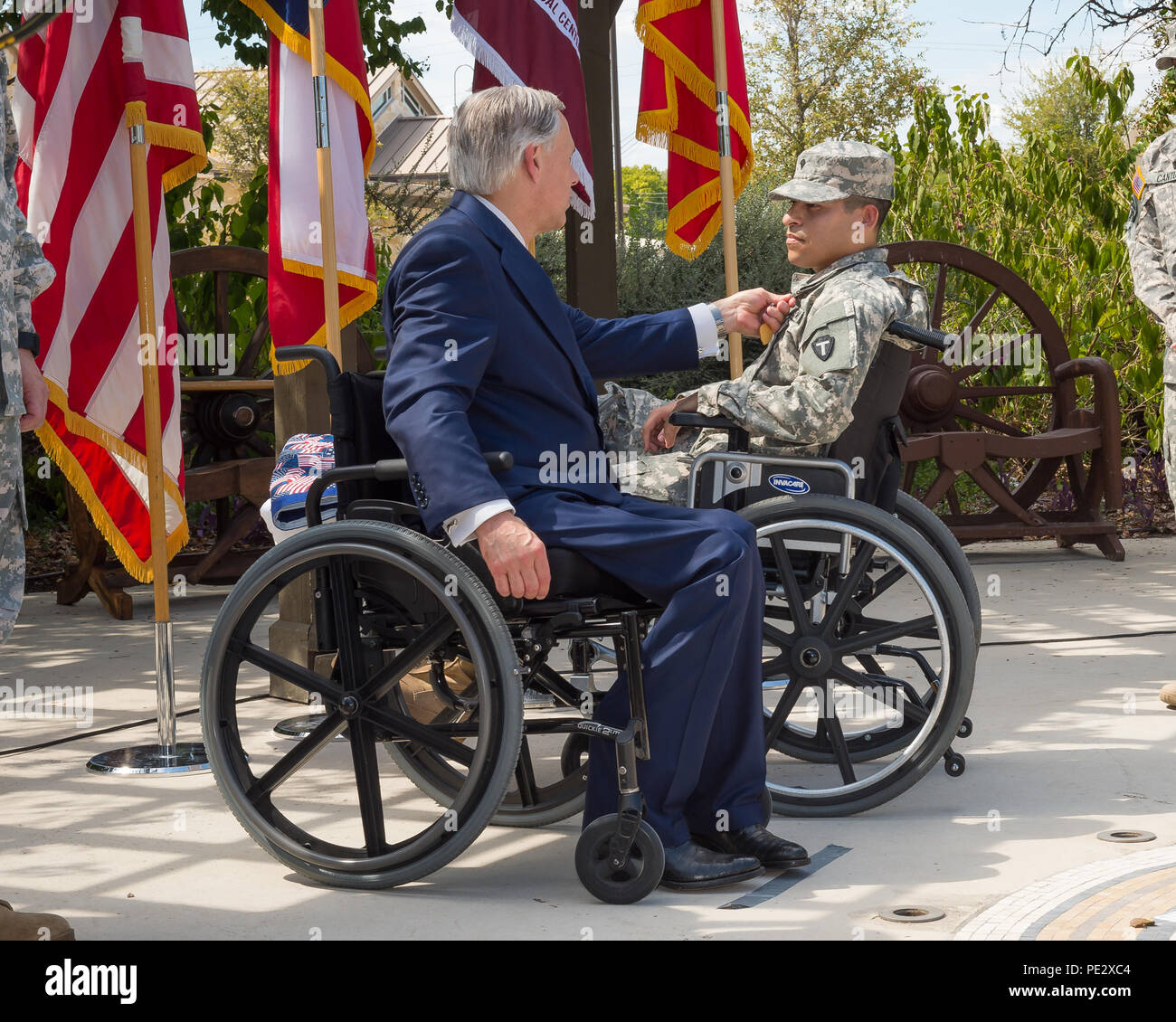 Texas Gov. Greg Abbott awards the Texas Purple Heart to Spc. Jose Romo ...