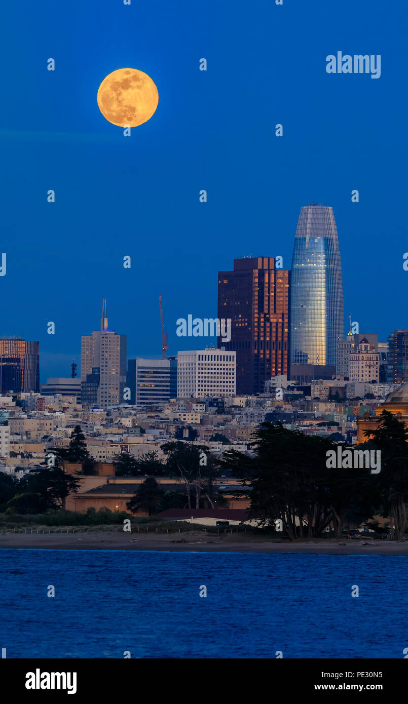 Pink moonrise above San Francisco Downtown landmarks viewed from Marina ...