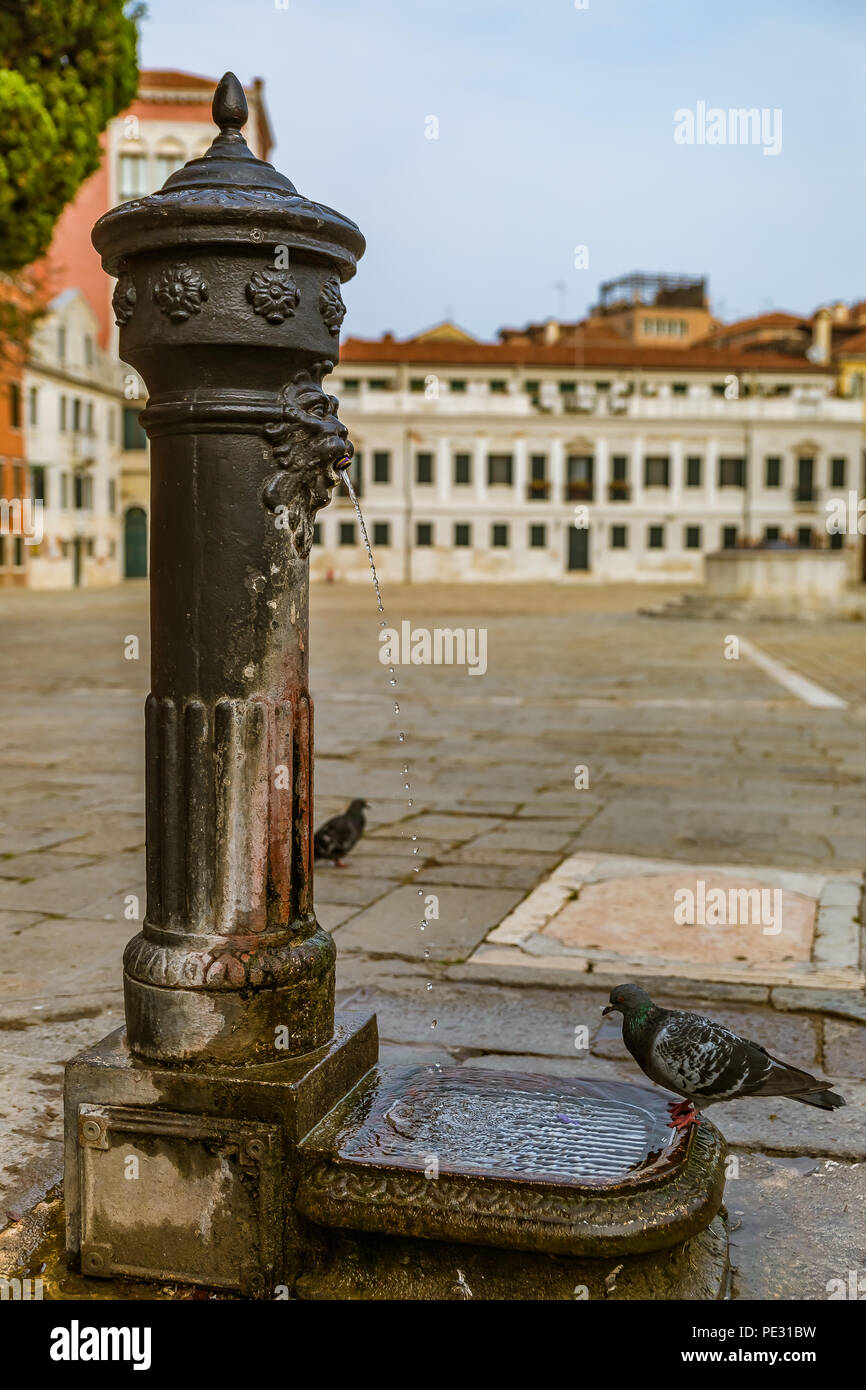 Antique ornate water pump in a courtyard in Venice Italy Stock Photo ...
