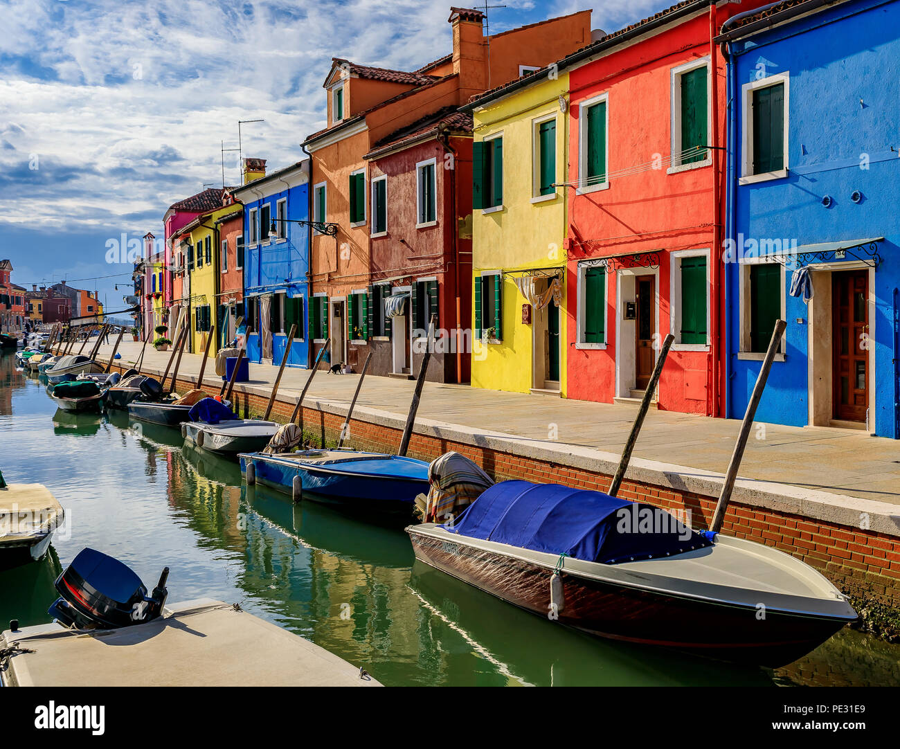 Picturesque canal and bright and colorful houses in Burano island near ...