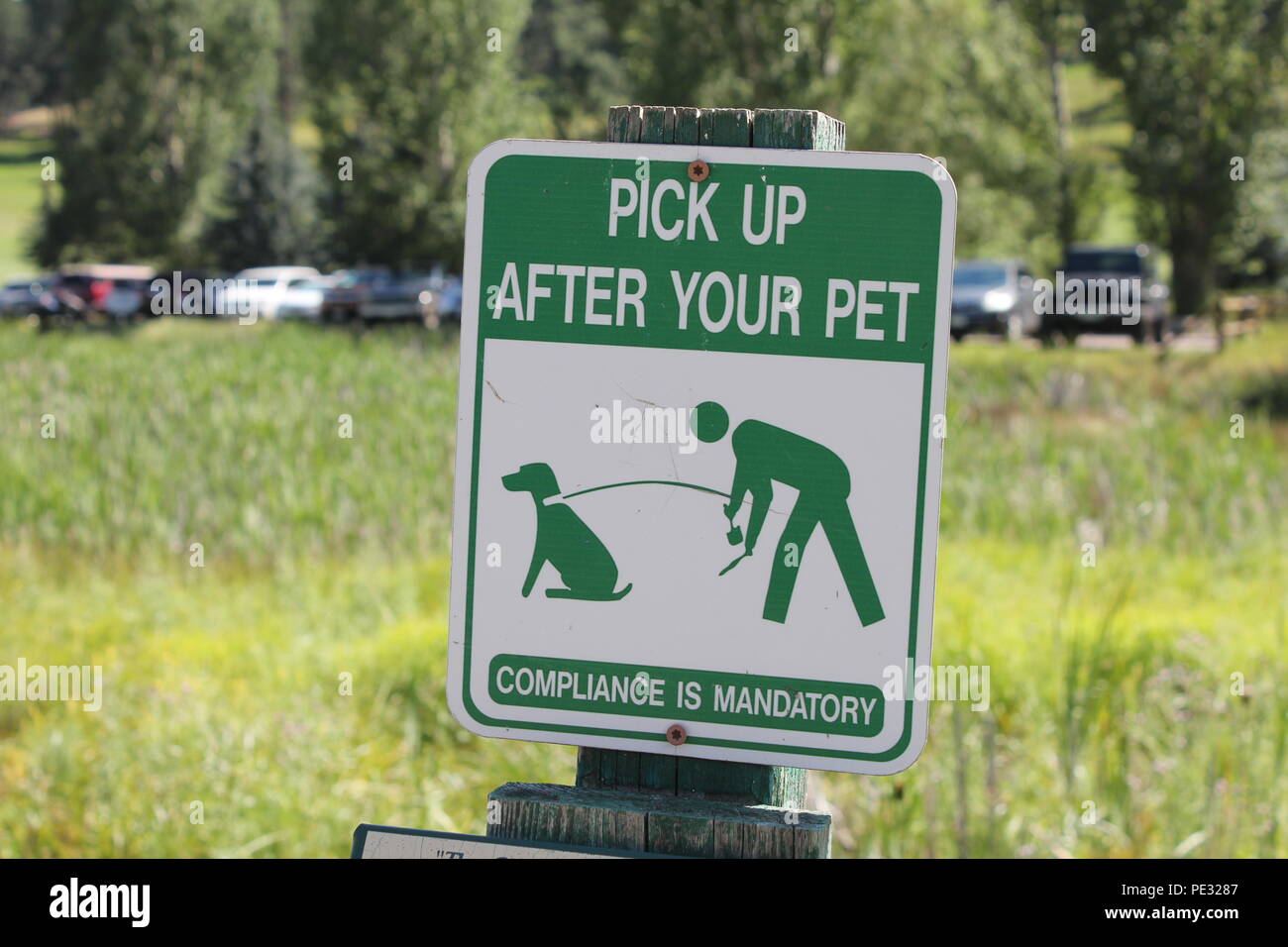 Pick Up After Your Pet Sign, Evergreen, Colorado, USA Stock Photo - Alamy