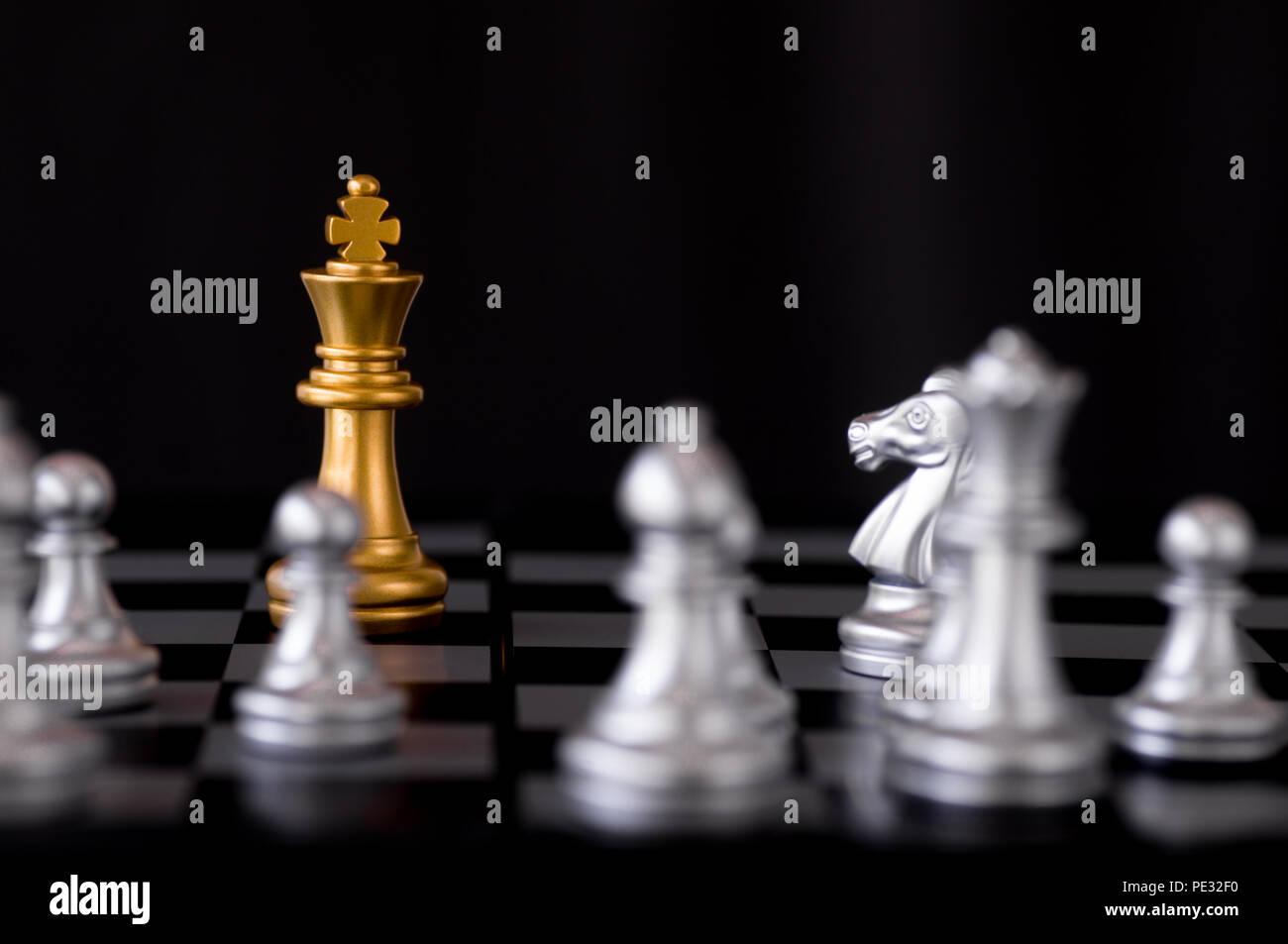 Queen chess set with enemy on black background Stock Photo - Alamy