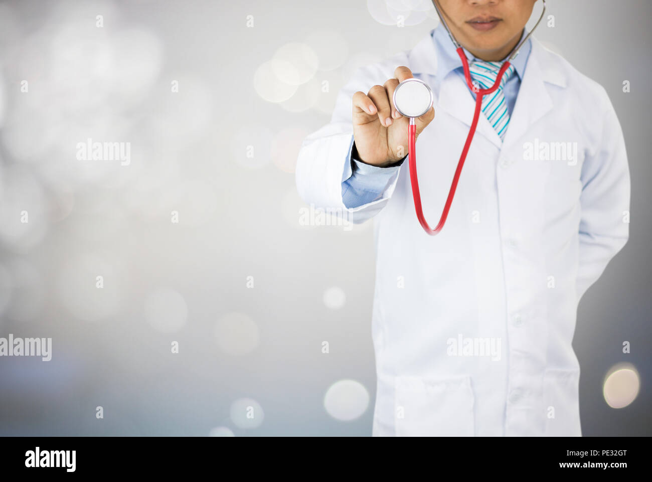 Healthy and illness concept, doctor holding stechoscope on gray and ...