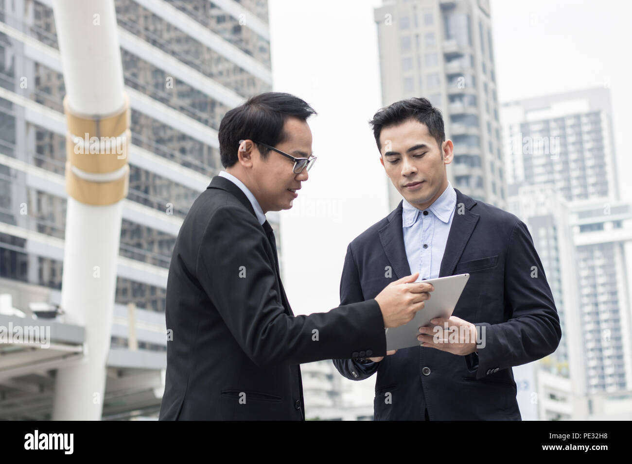 Businessman presenting work to boss, leader about planning project by ...