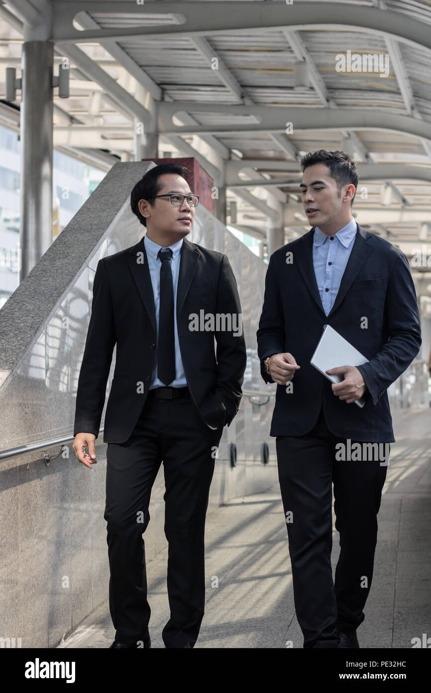 Businessman presenting work to boss, leader about planning project ...