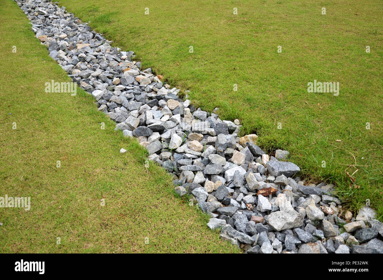 Stone and green grass in the garden Stock Photo - Alamy