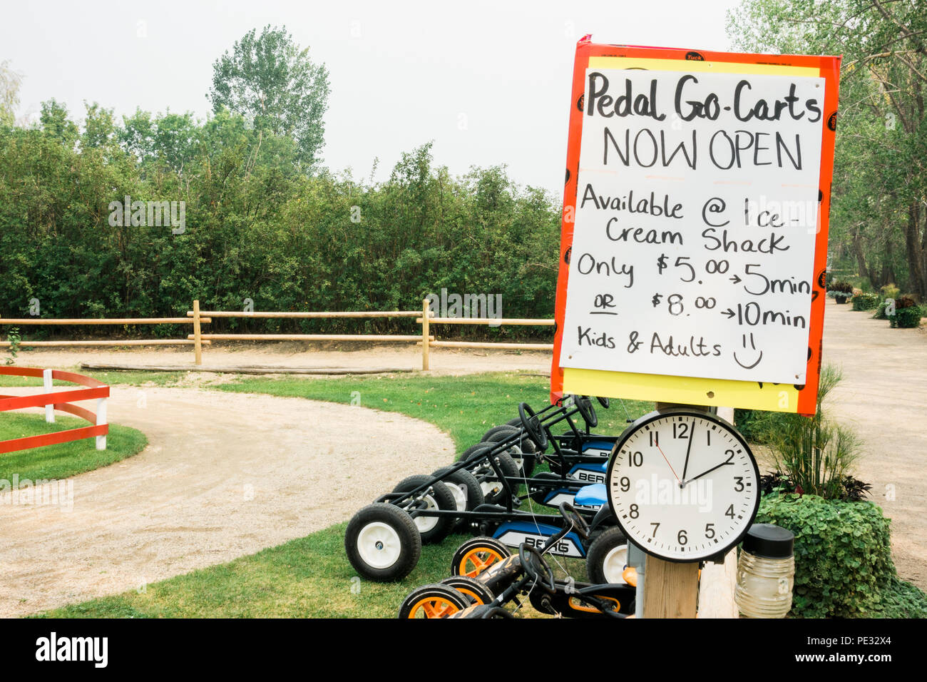 a signage and go carts Stock Photo - Alamy