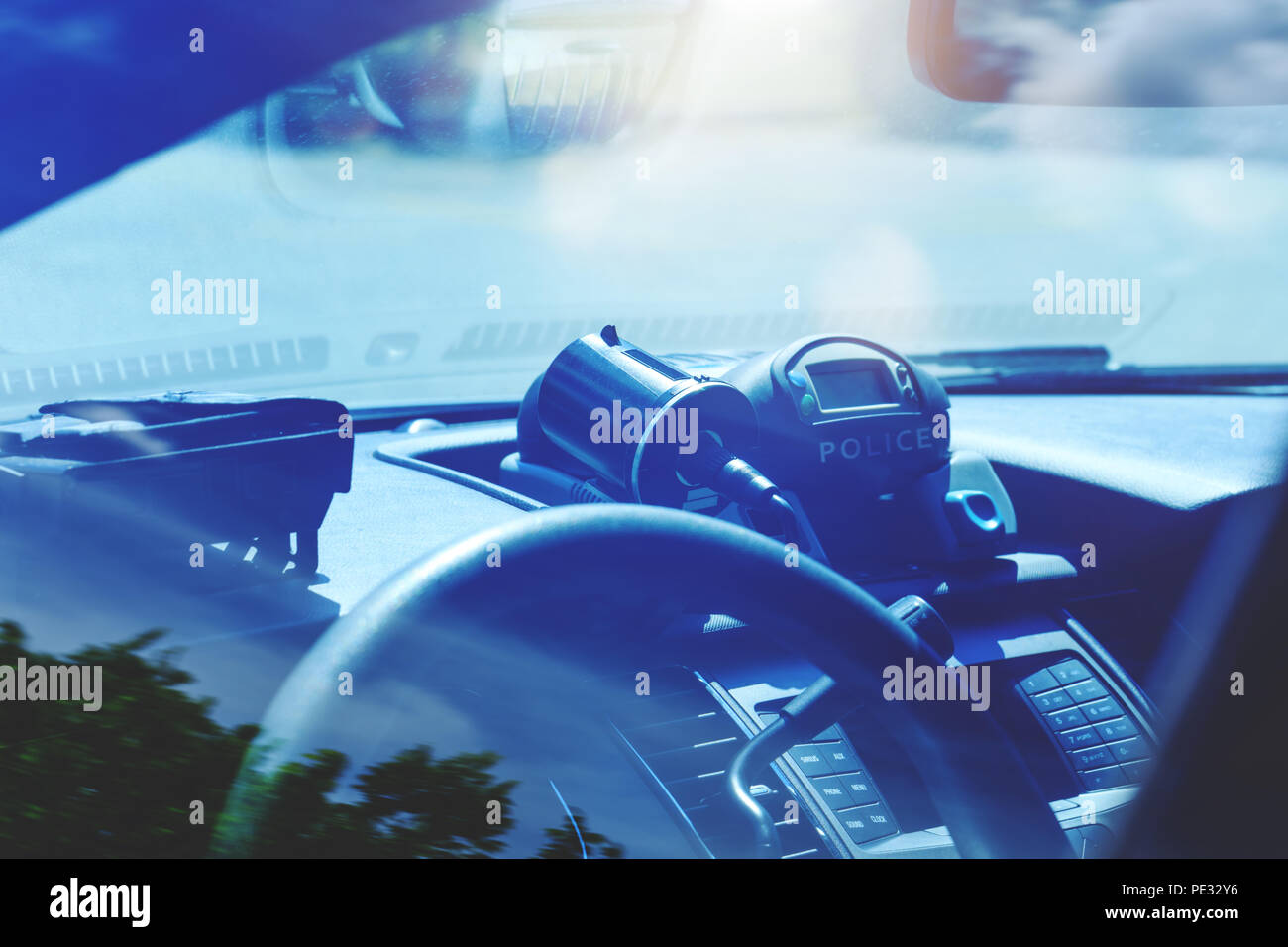 Police radar inside of police car. Patrol monitors traffic on a highway ...