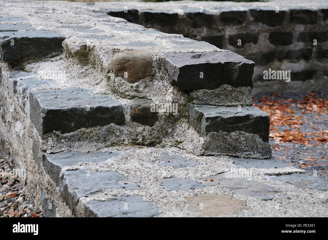 fragments of a roman base wall in a public park in Kempten, Germany ...