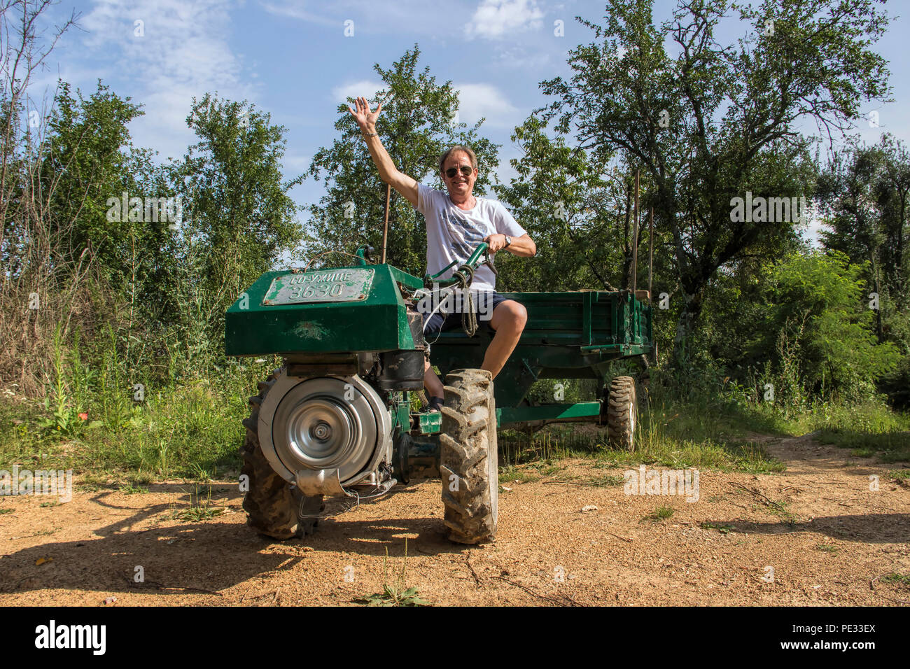 Farmer waving hi-res stock photography and images - Alamy
