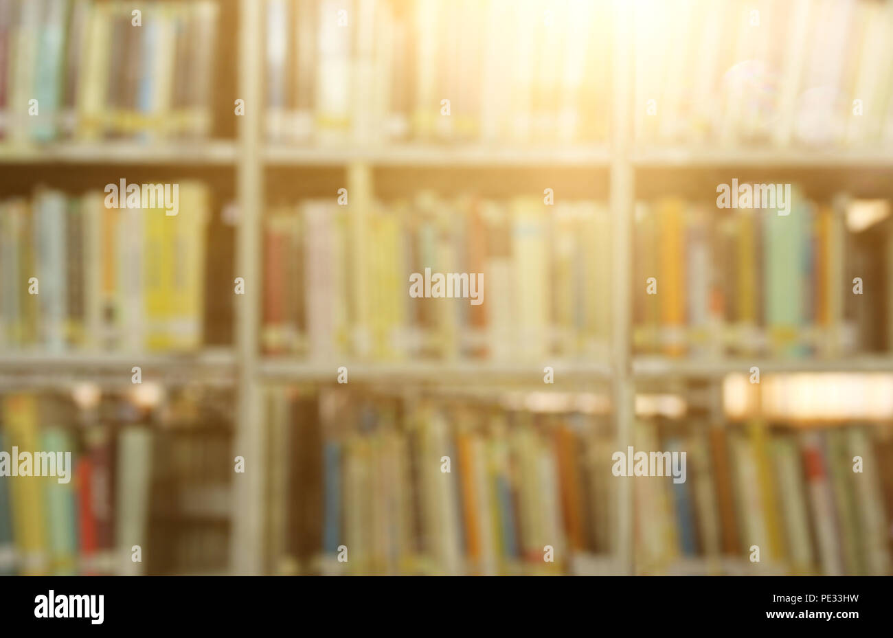 abstract background of blurred books in public library. retro style ...