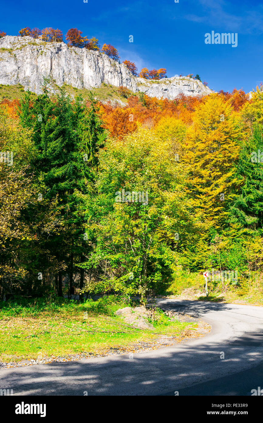 rocky cliffs over the forest. dangerous part of the mountain road Stock ...