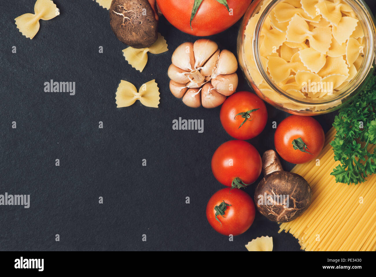 Italian food concept. Pasta ingredients. Cherry-tomatoes, spaghetti ...