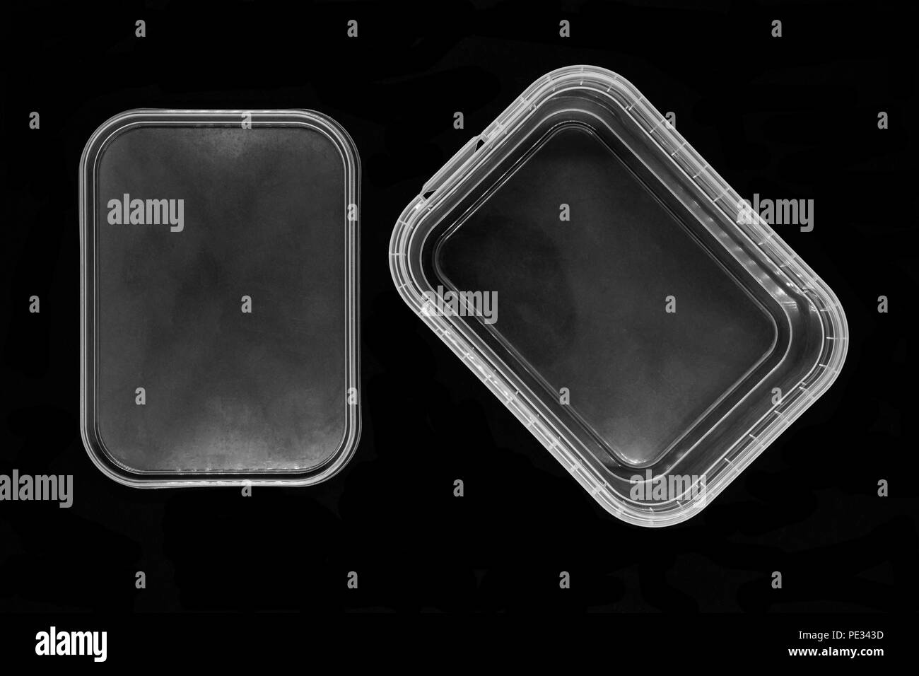 Transparent plastic box bottom separated from lid and isolated on black ...