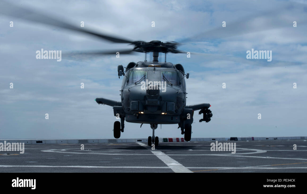 A MH-60R Seahawk helicopter lands aboard the USS Somerset during ...