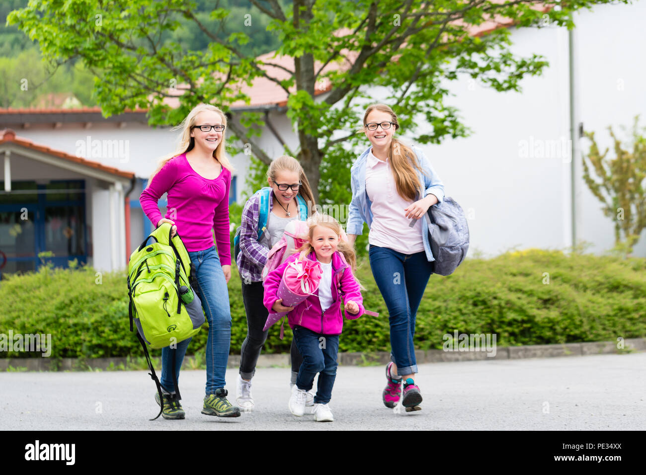Pupils or students at schoolyard in recess Stock Photo - Alamy