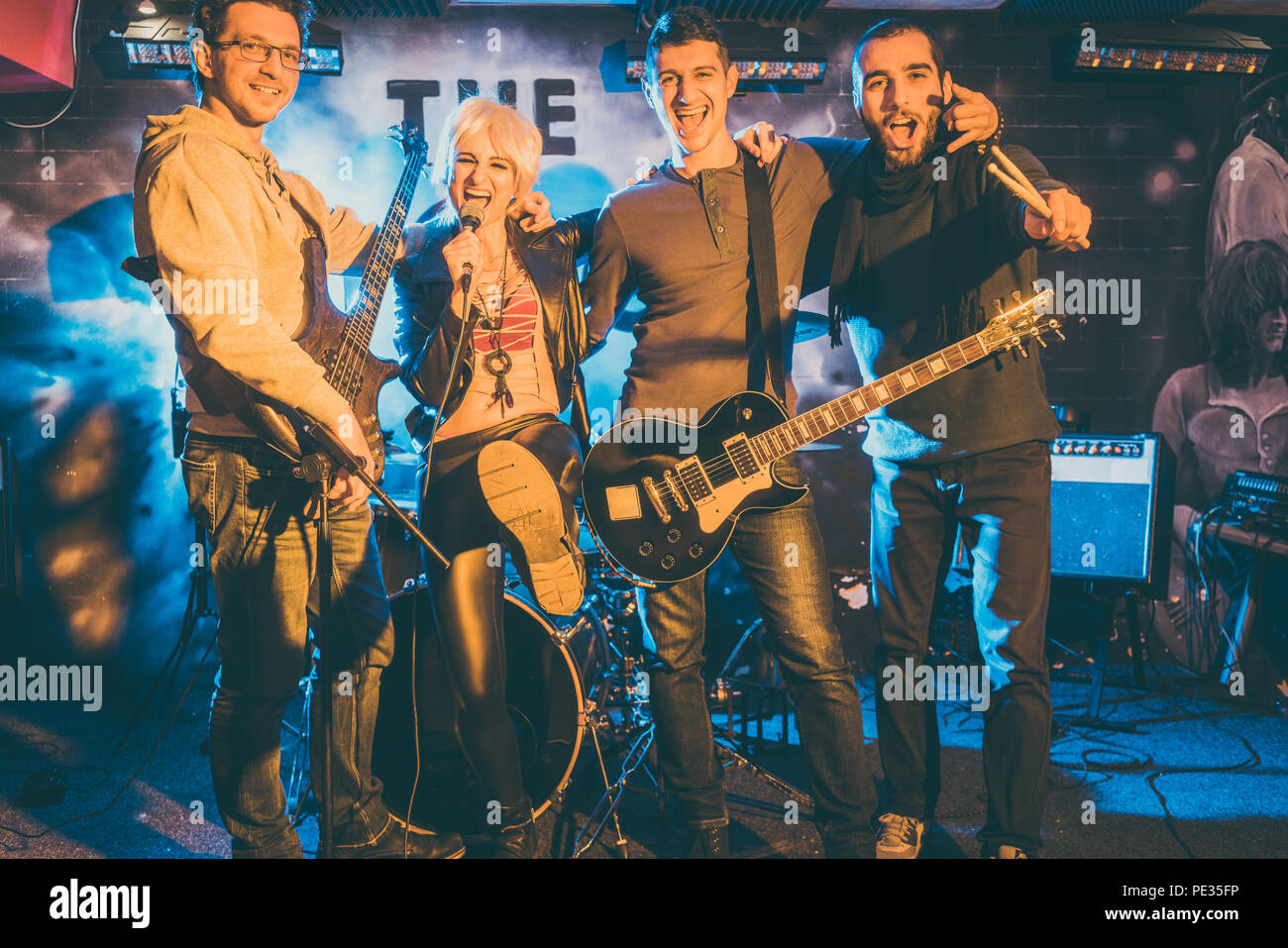 Rock band on stage after successful concert Stock Photo - Alamy