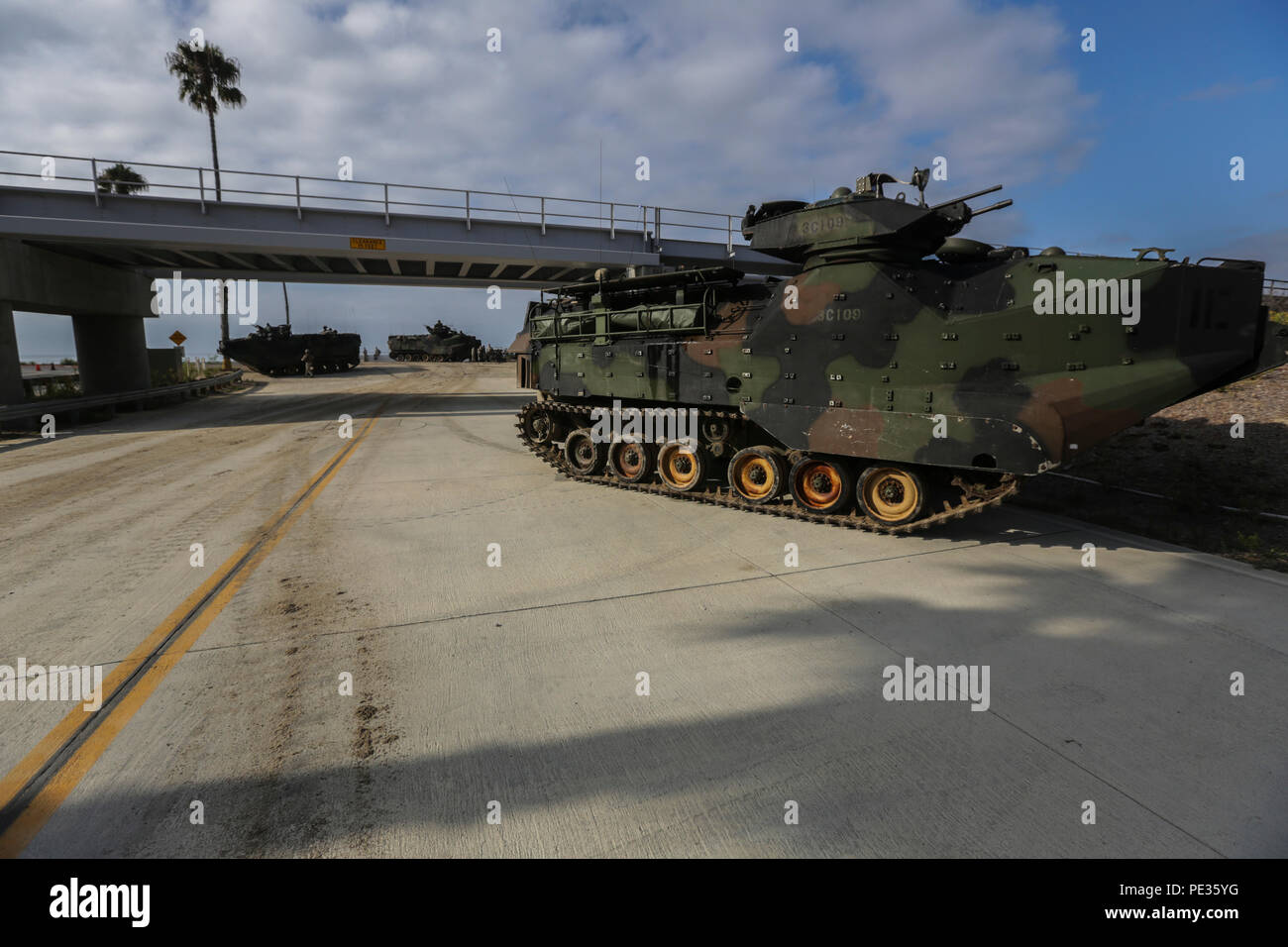 U.S. Marines with 3rd Assault Amphibian Battalion, prepare vehicles for ...