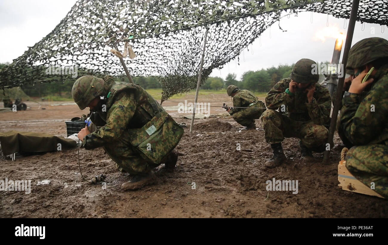 A Japanese Ground Self-Defense Force member pulls the string firing the ...