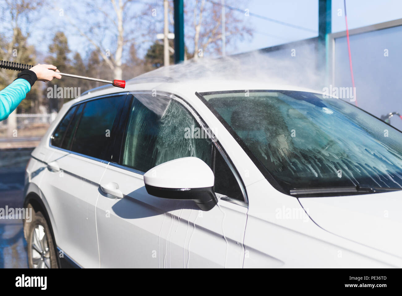 Car washing. Cleaning car using high pressure water Stock Photo - Alamy