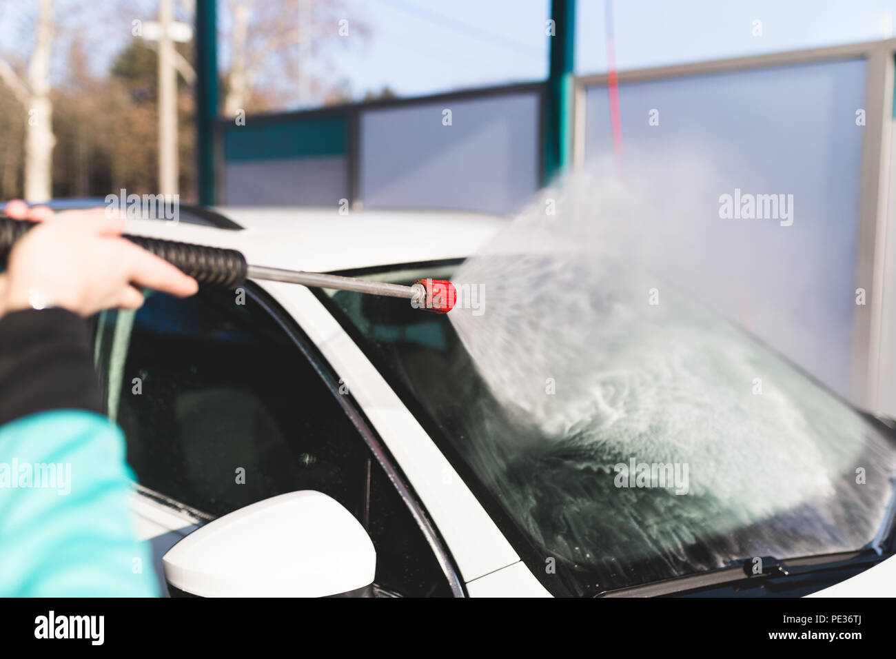 Car washing. Cleaning car using high pressure water Stock Photo - Alamy