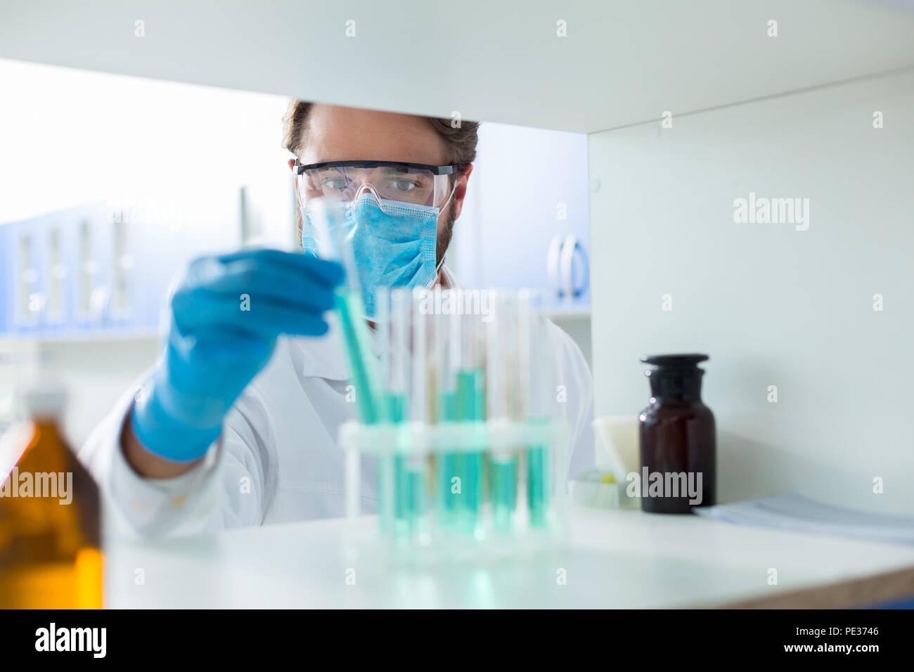 Medical research. Smart nice professional scientist looking at the test ...