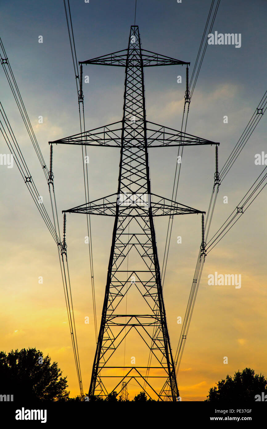 Power lines shot against a sunset in portrait format Stock Photo - Alamy
