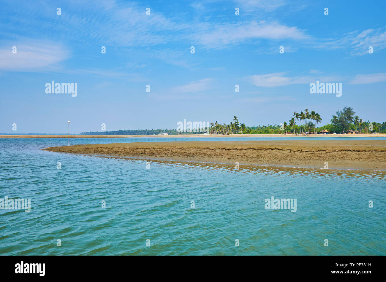 The narrow land spit is surrounded by saline waters of river's estuary ...