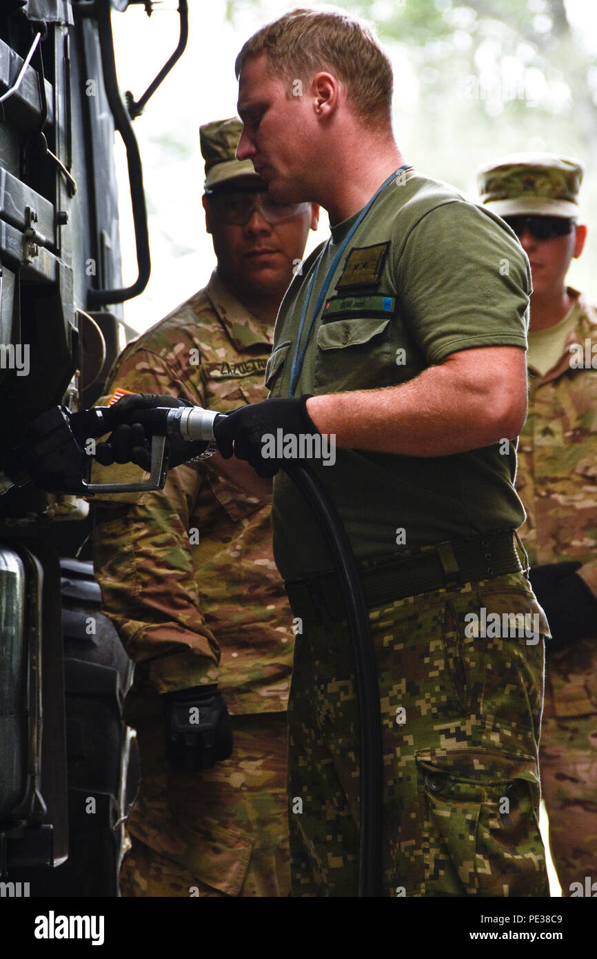 Pfc. Ty Zazueta (rear left,) a combat medic and Sgt. Xavier Bermudes ...
